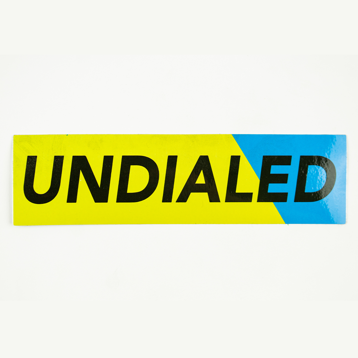 Undialed Boxed Sticker - Yellow and Blue – The Vault Pro Scooters